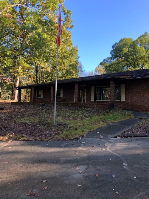 This poor sad looking house needs help.