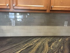 Backsplash recommendations for black fantasy leathered granite?