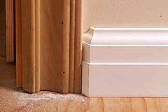 Baseboard is wider than door casing