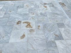 HELP!! Mystery stains on new marble pool deck