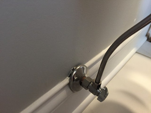 Toilet connection in baseboard