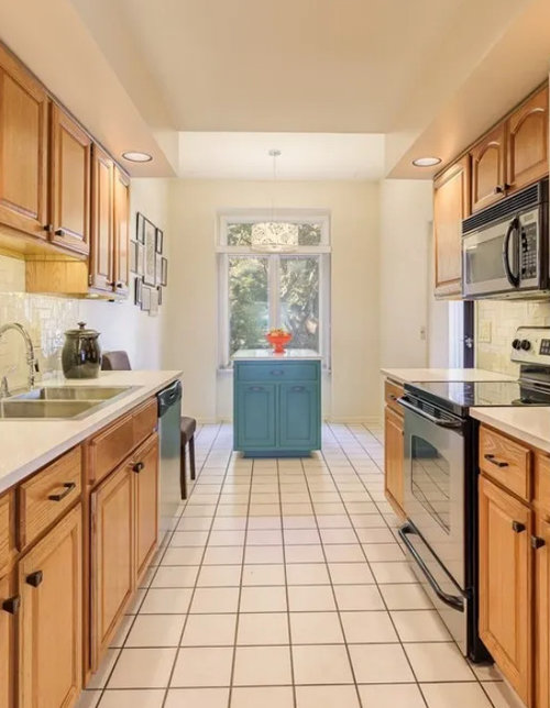 Design eat-in area of galley kitchen - storage piece & courtyard view ...