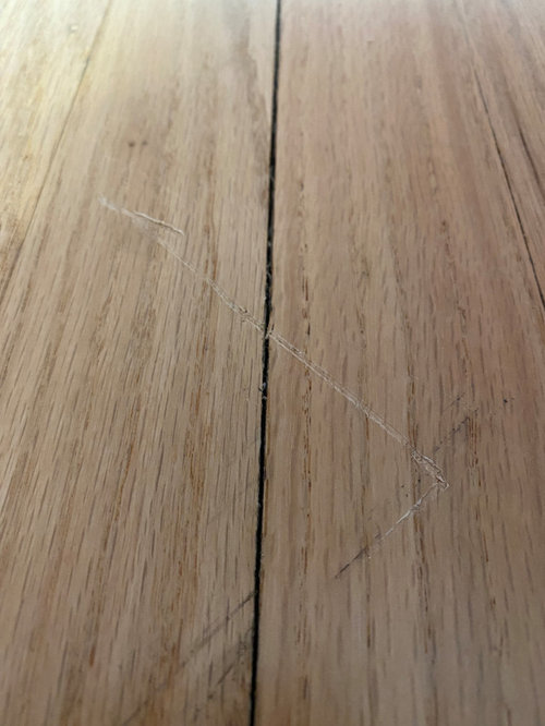 How to fix wood floor scratch?