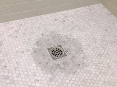Marble tile discoloration in shower