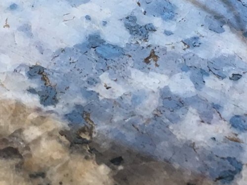 Very pitted granite counter top.