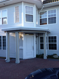 I need a design solution for an overhang for the front door without posts.