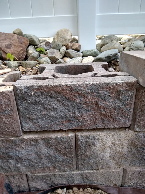 Replacing blocks in a retaining wall