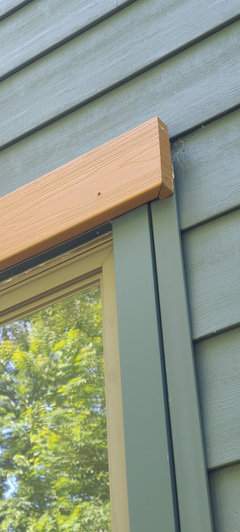 I’m adding faux cedar headers above windows