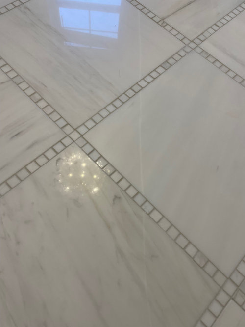 Mysterious White Lines on Marble Tile Floor