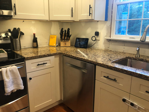 ideas for backsplash with busy brown countertops