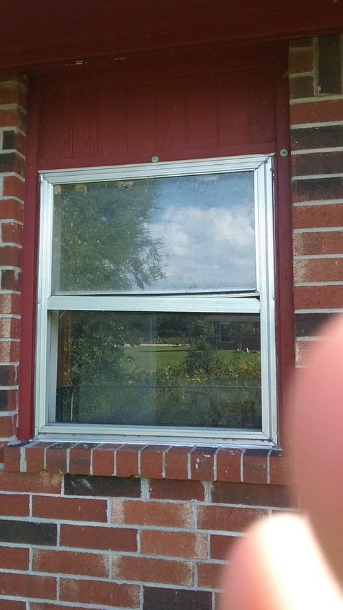 Red brick and siding colors? What to do with odd space above windows..