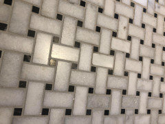 Grout bleeding into marble tiles