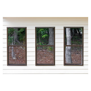 Bronze windows complement the white siding - Craftsman - Exterior ...