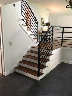 Redesign stairs to eliminate awkward landing in entry.