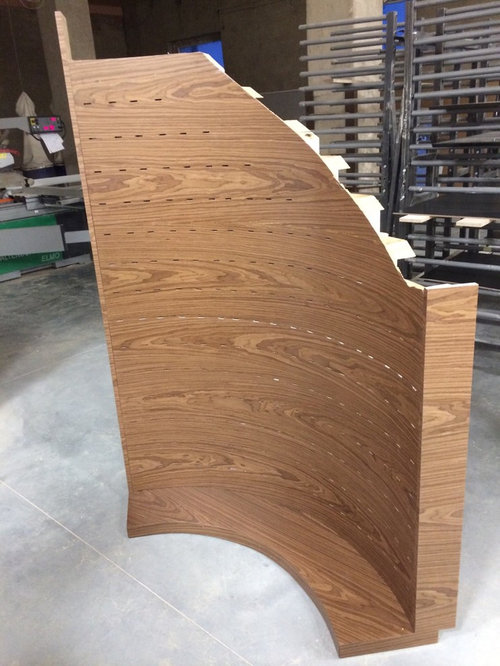 Curved Wine rack with metal strips.