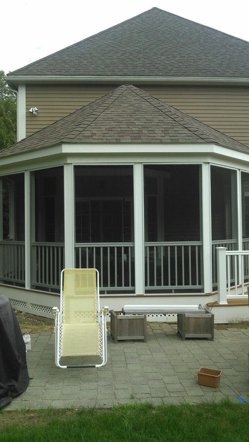 Octagon shape, turret style roof, screened porch.