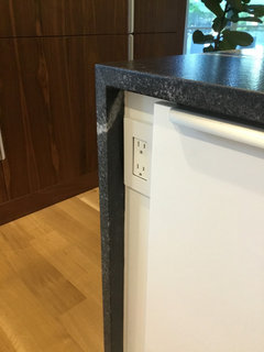 Outlet placement on granite waterfall island