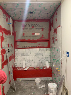 Permanent "wet" look in white marble mosaic; not good