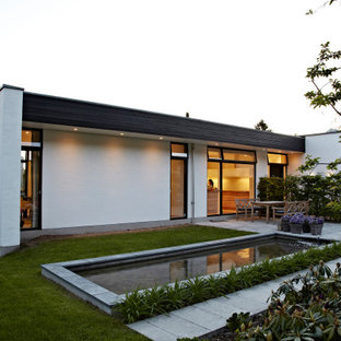 75 Beautiful Split-Level Exterior Home With A Black Roof Pictures ...