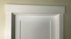 Fluted door and window trim with rosettes