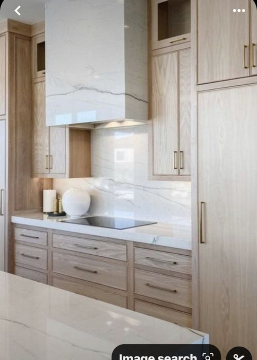 quartzite wrapped range hood?