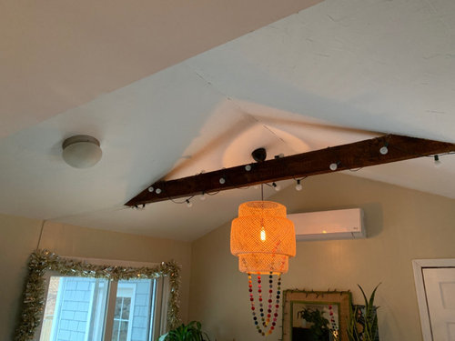 awkward light fixture on sloped ceiling