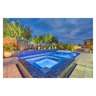 Contemporary Backyard Pool with Tiled Water Feature, Rim Flow Spa ...