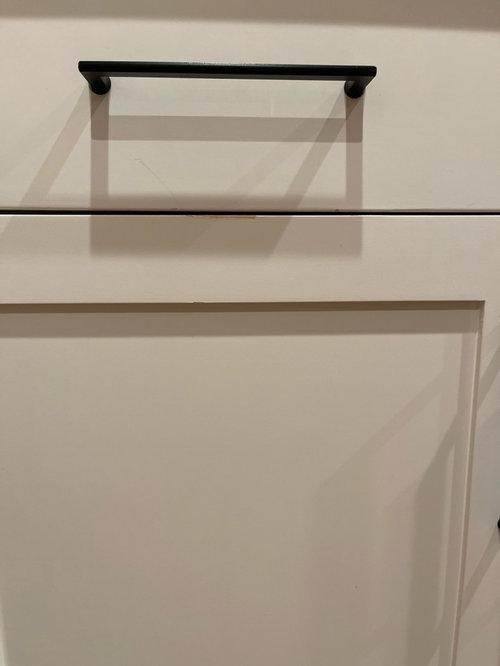 How does one repair these small cabinet blemishes?