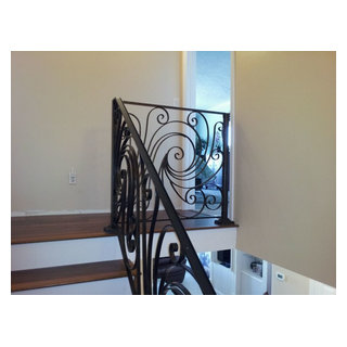 Scroll style custom ornamental iron stair rails - Staircase - Orlando ...