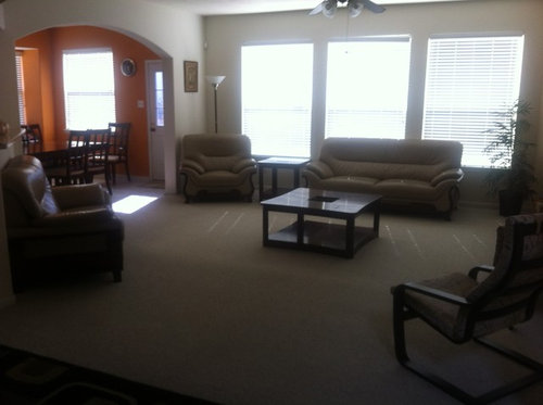 Merging two different sofa sets in one big living room..