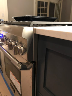 How flush should my thermador range be to front of cabinets/counter?