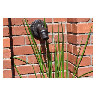 Brick Fountain detail of bronze duck scupper - Traditional - Los ...