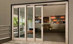 Sliding patio doors with low threshold