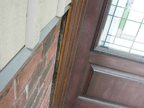 How do we finish the outside cladding around the front door?