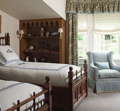 Two full beds in a hexagon (or octagon?) shaped bedroom