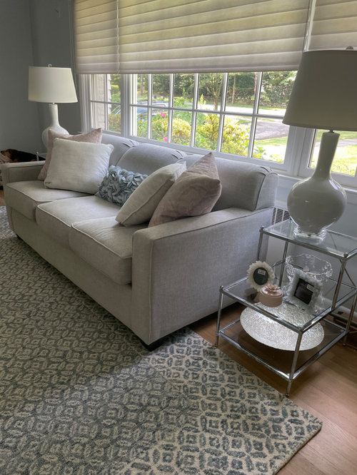 Should end tables go on or off the rug?