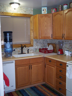 Kitchen sink NOT centered w/window. Which sink will disguise it ...