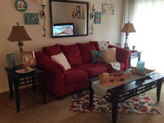 How do I use a red traditional sofa in a neutral room?