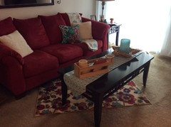 How do I use a red traditional sofa in a neutral room?