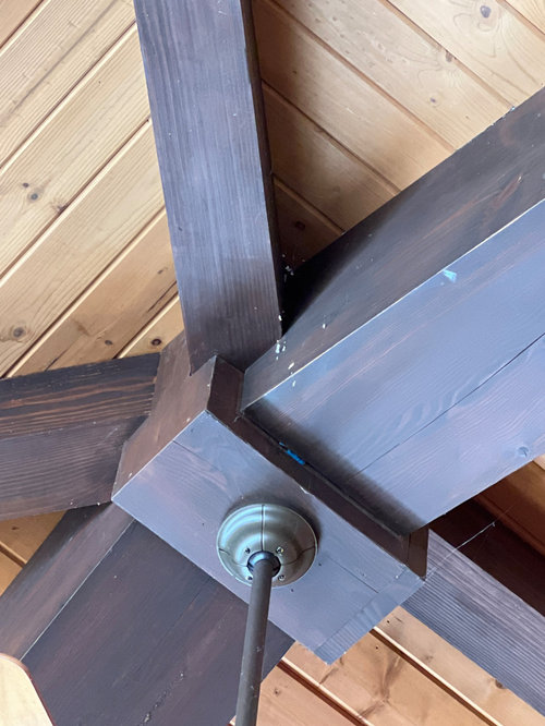 Insulation falling from wood ceiling.