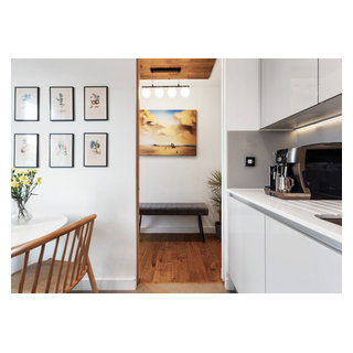 Modern Sleek White Kitchen with Dalí-Inspired Art and Wooden Accents in ...
