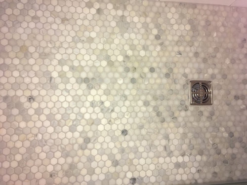 Marble tile discoloration in shower