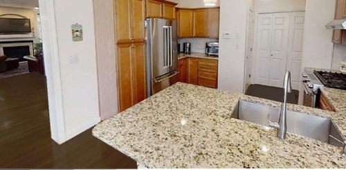 BM white wall & trim color in kitchen with maple cabinets
