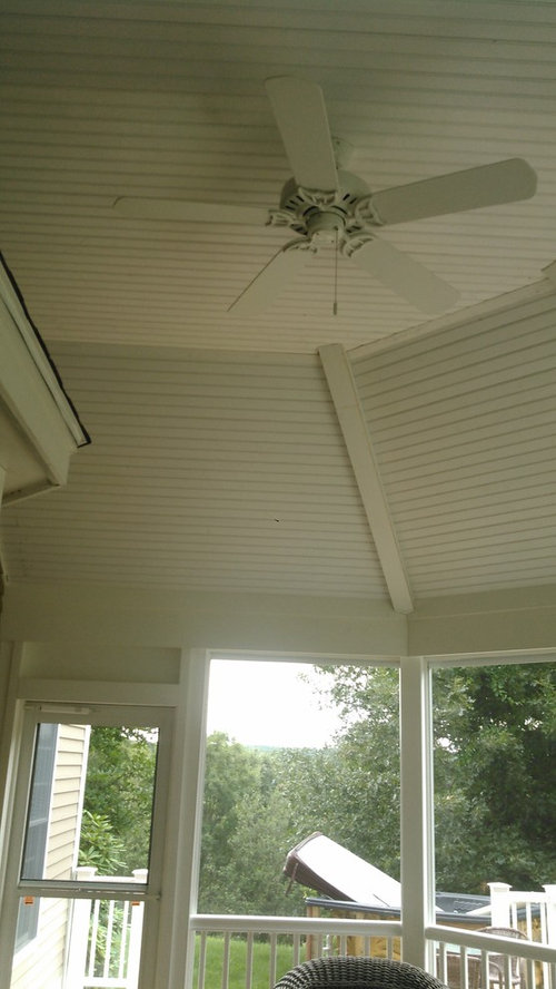Octagon shape, turret style roof, screened porch.