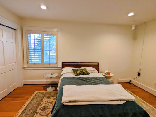 Design help for bedroom with off-center windows