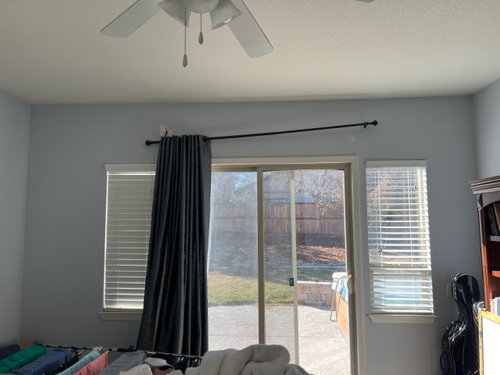 Drapes help in Master with asymmetrical windows.