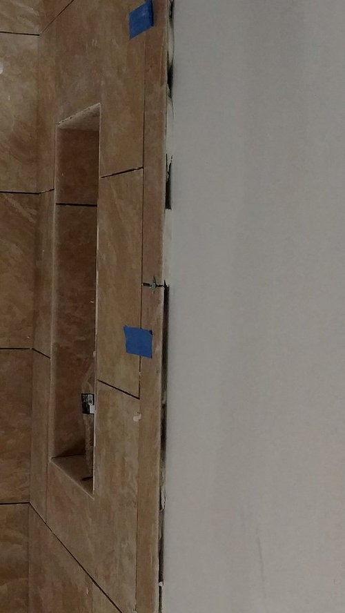 Bad Tile Job? 1/2" space between wall and bullnose