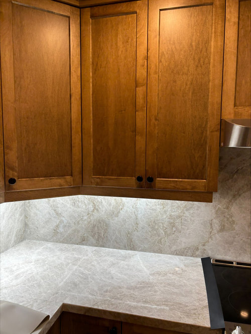 Wall Paint colors for Taj Mahal Quartzite with Medium Brown Cabinets