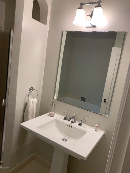 Overhead vanity light or sconces?