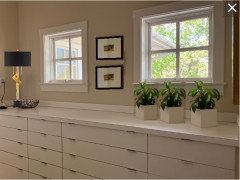 ideas how to make this countertop look better? Windows not centered.